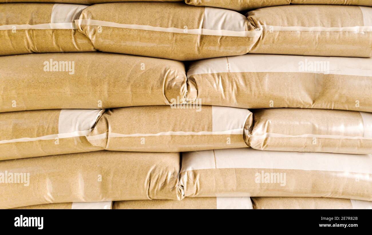 Closeup of stacked sand sacks under the lights in the warehouse Stock ...