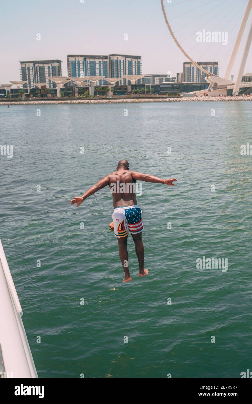 Man jumping sea from boat hi-res stock photography and images - Alamy