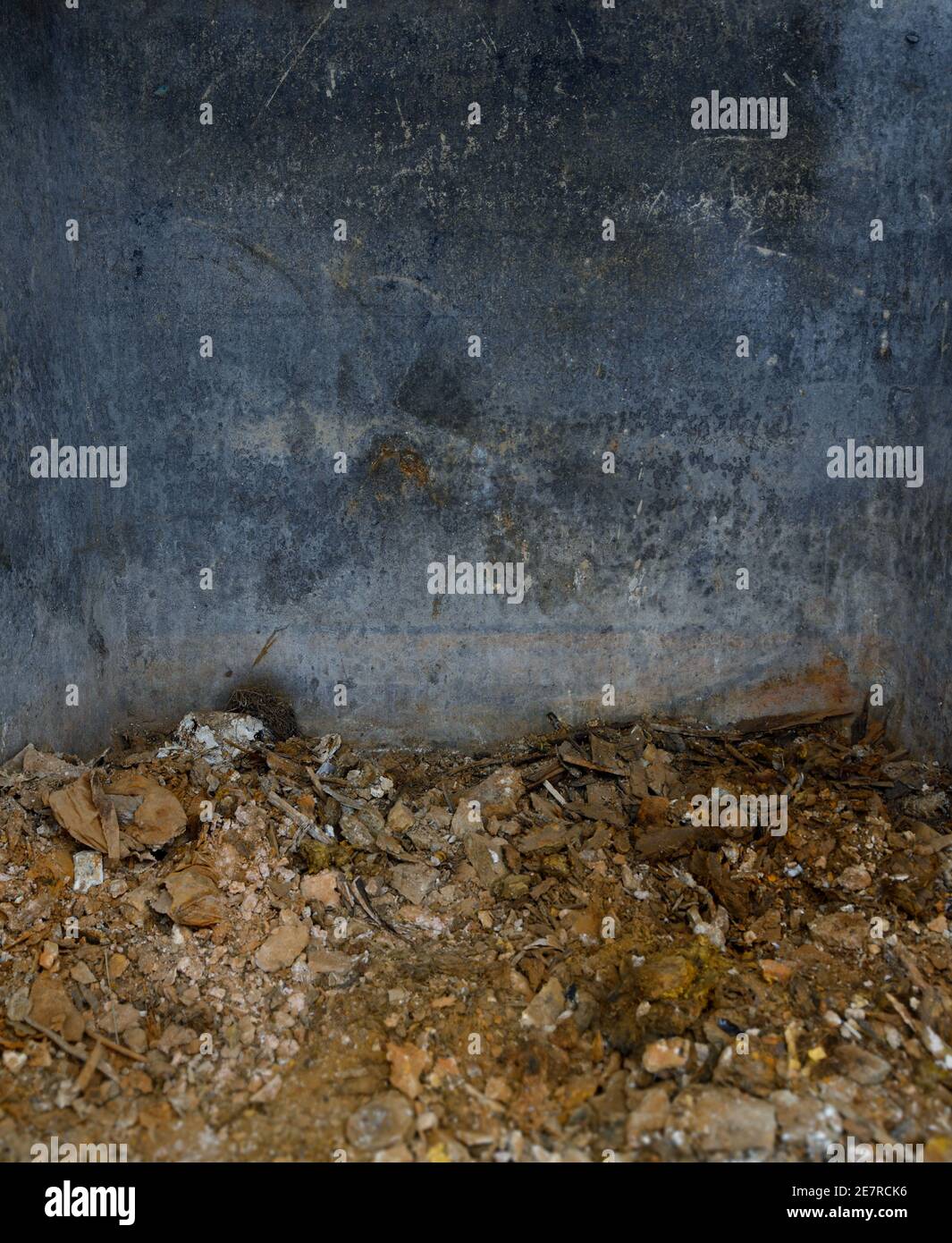 Rubble in old, weathered, dirty cave with concrete spotted walls Stock ...