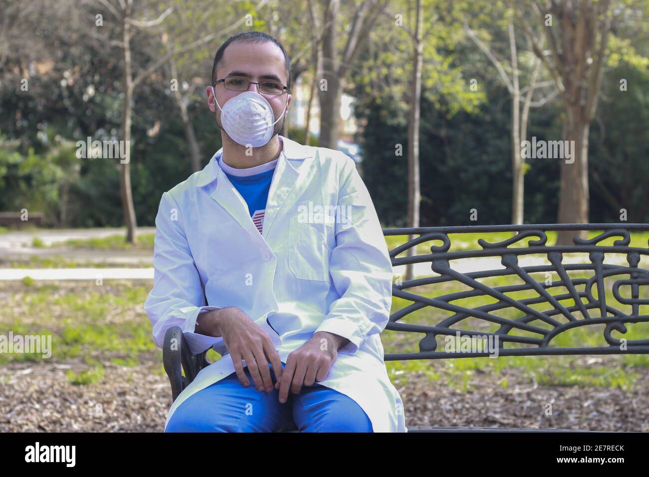 Medical doctor sitting on bench hi-res stock photography and images - Alamy