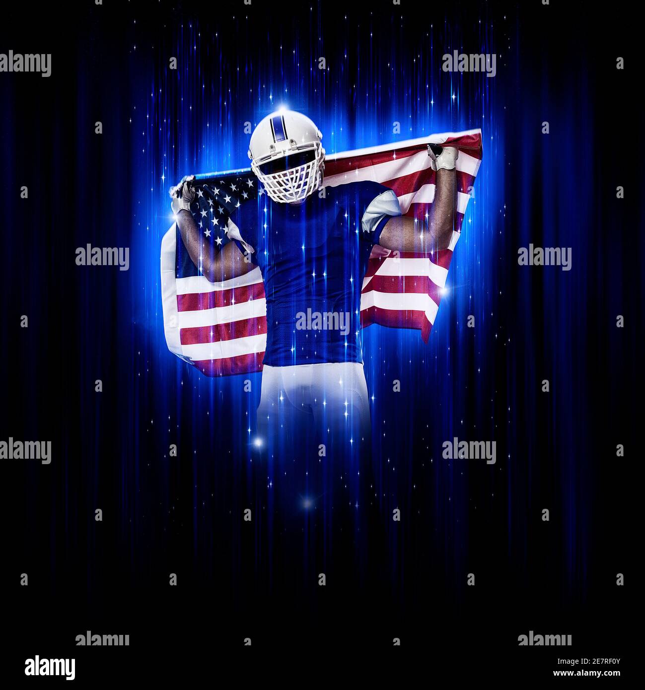 Football Player player with a superhero pose wearing a blue uniform on ...