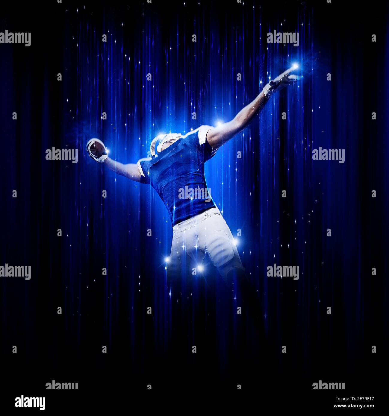 Football Player player with a superhero pose wearing a blue uniform on ...