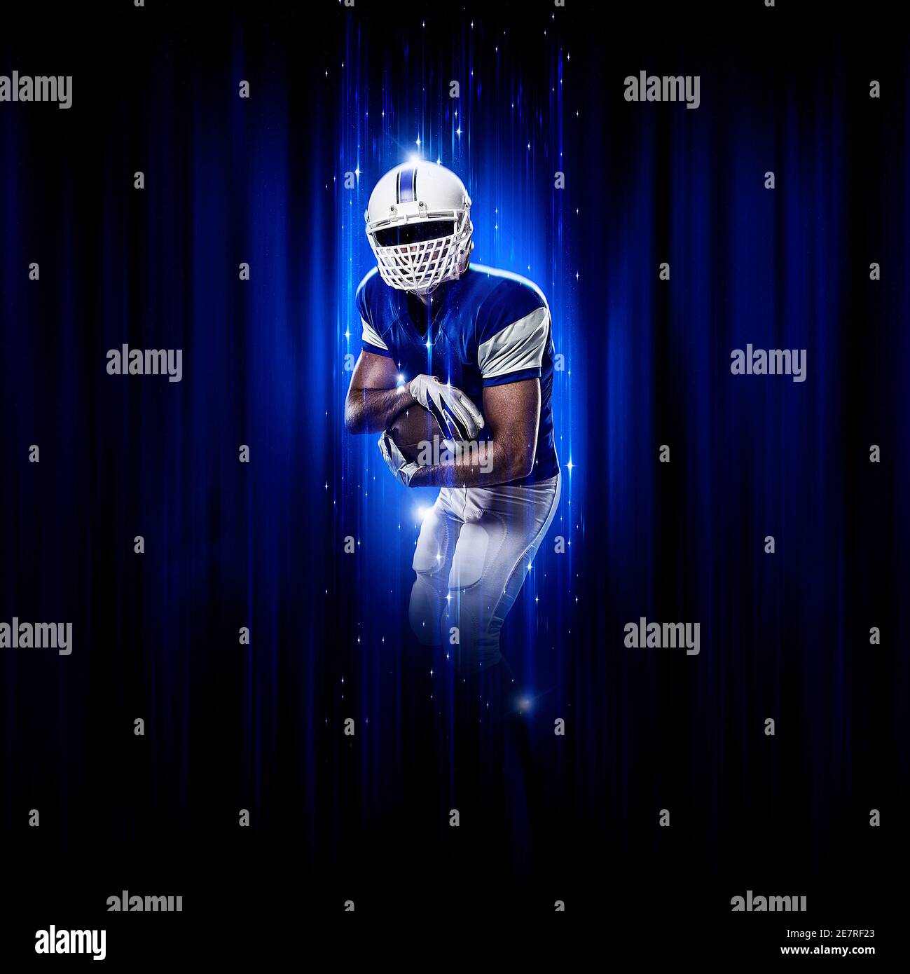 Football Player player with a superhero pose wearing a blue uniform on ...