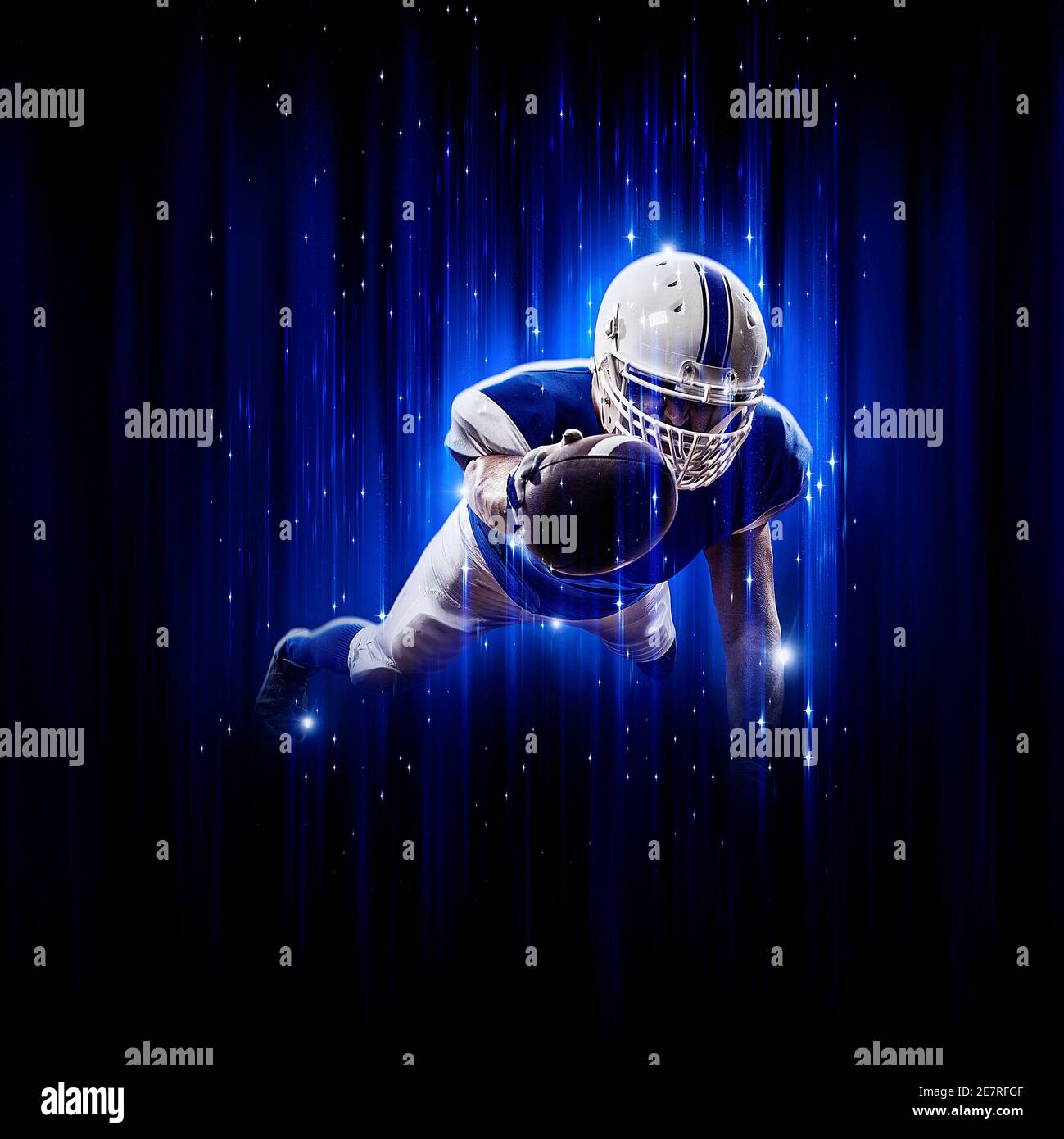 Football Player player with a superhero pose wearing a blue uniform on ...