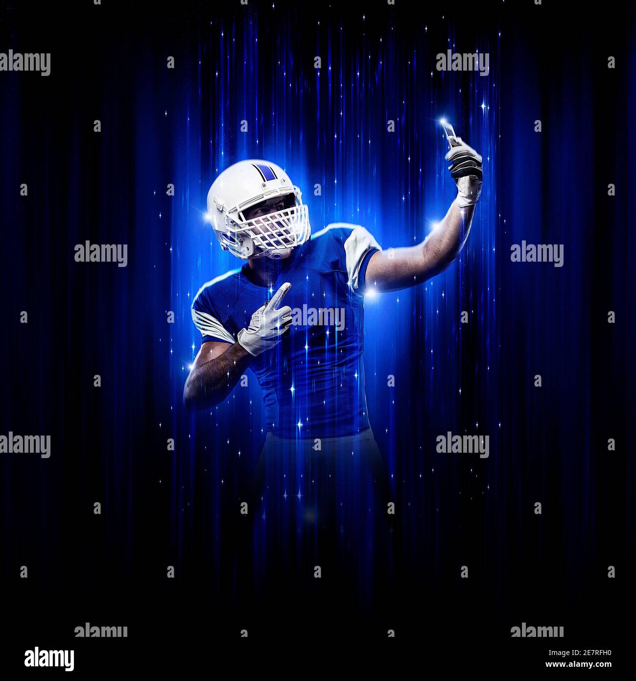 Football Player player with a superhero pose wearing a blue uniform on ...