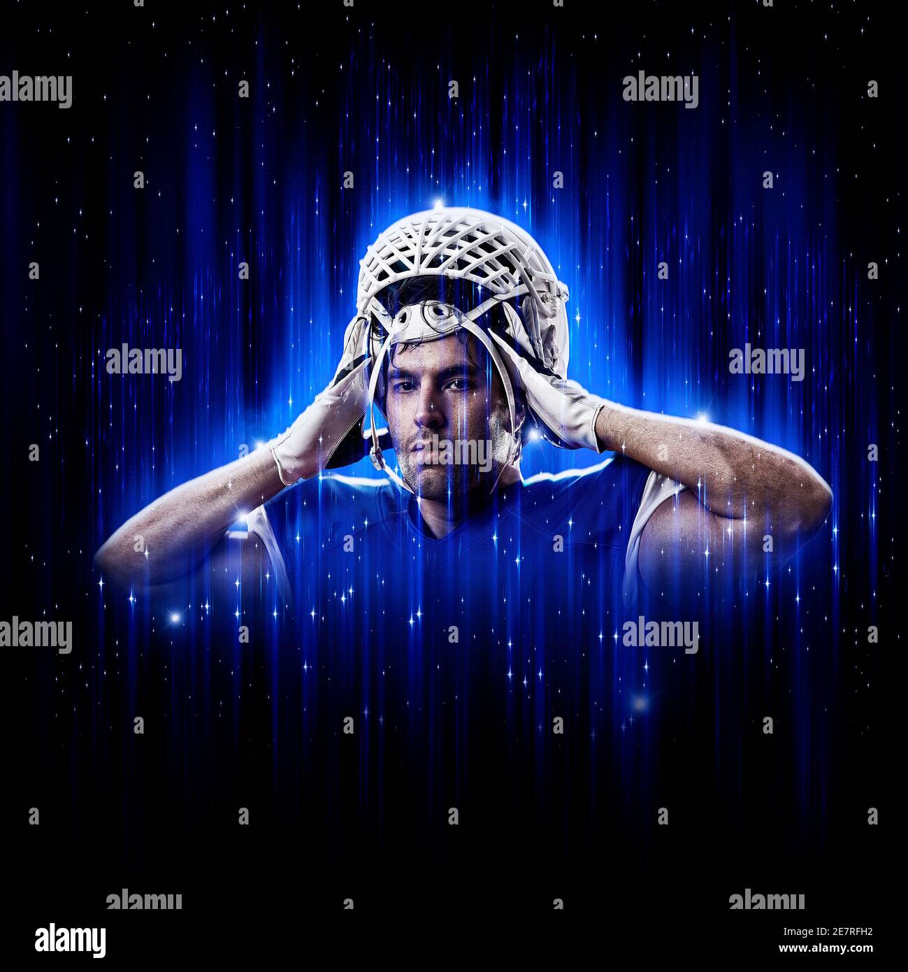 Football Player player with a superhero pose wearing a blue uniform on ...