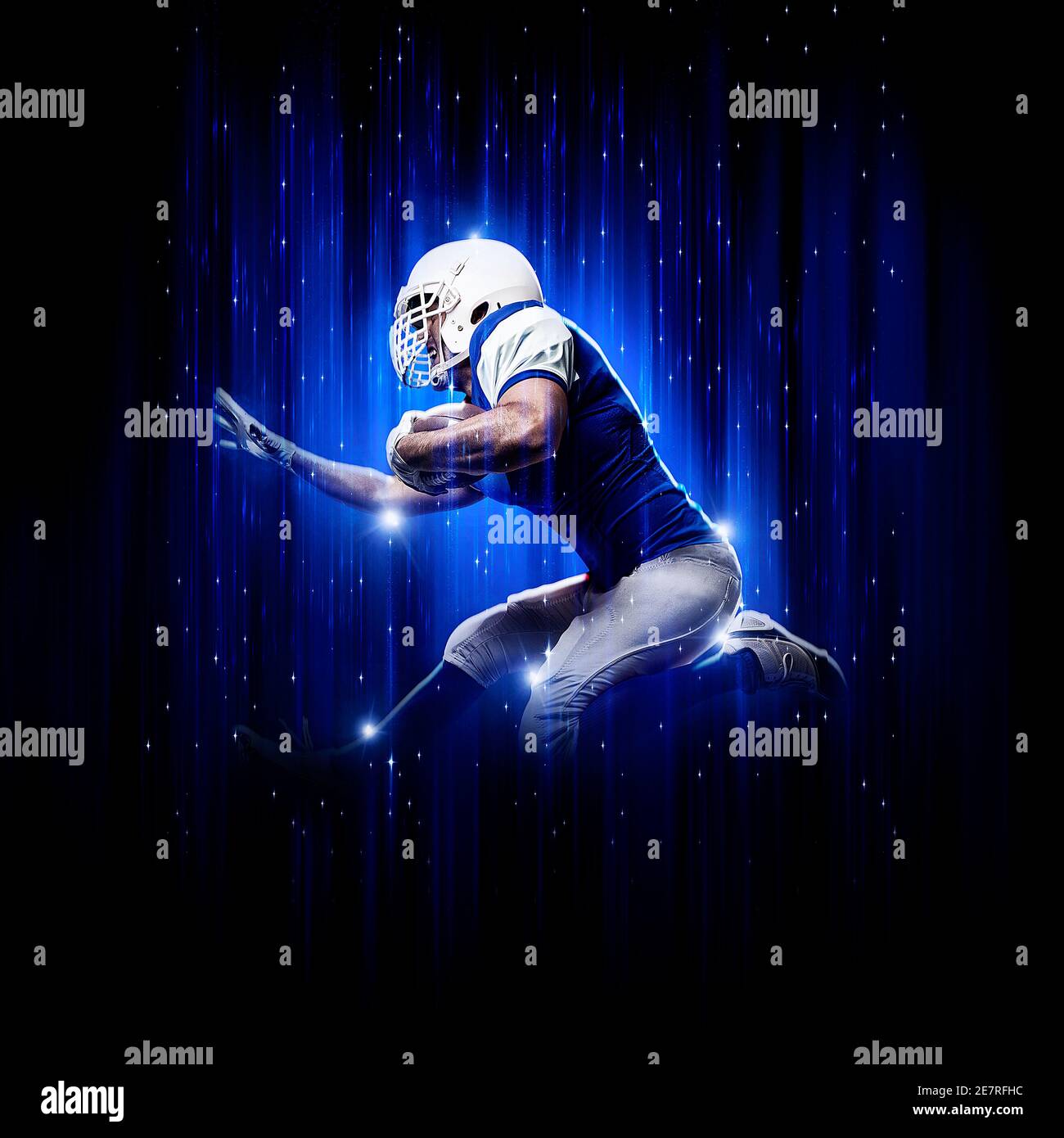 Football Player player with a superhero pose wearing a blue uniform on ...