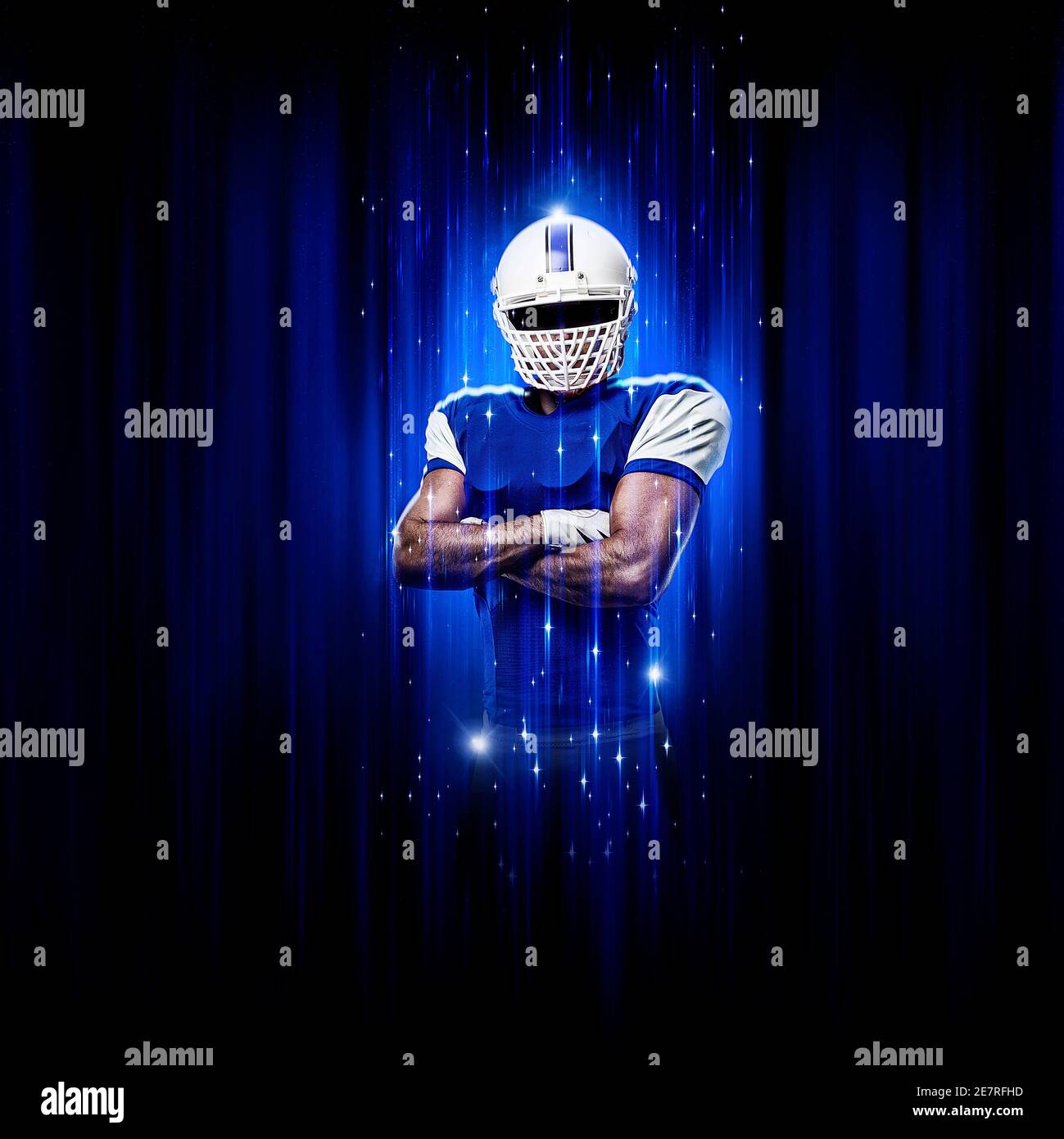 Football Player player with a superhero pose wearing a blue uniform on ...