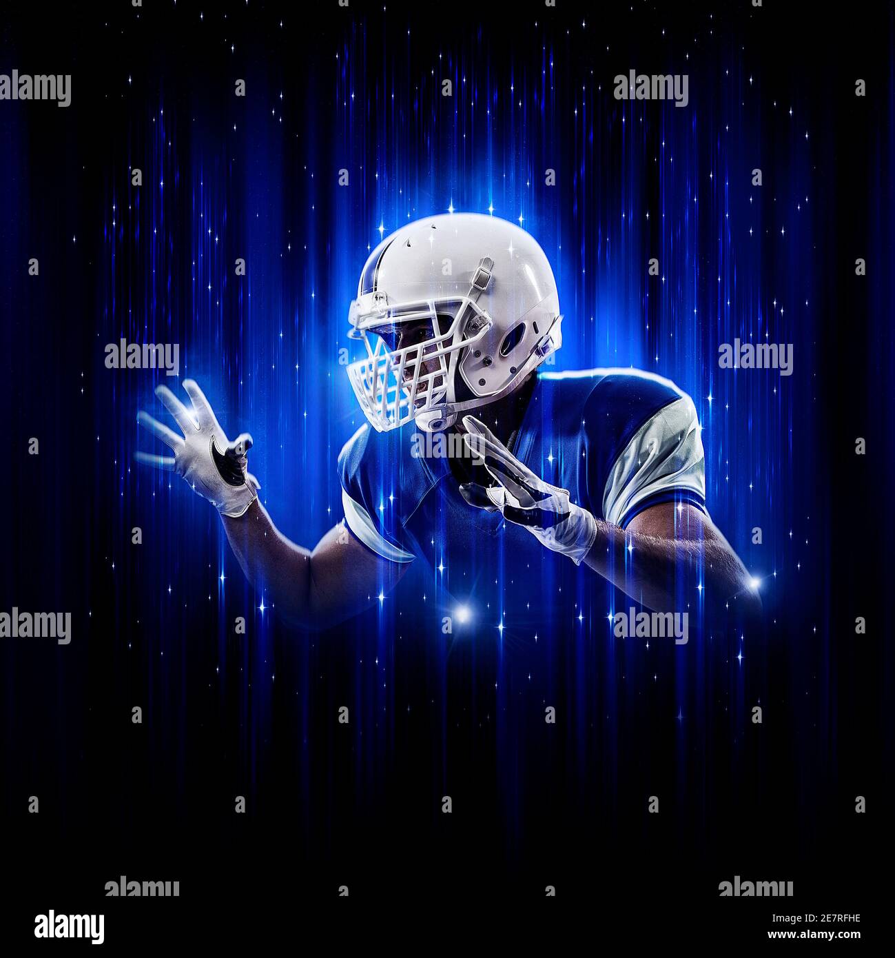 Football Player player with a superhero pose wearing a blue uniform on ...