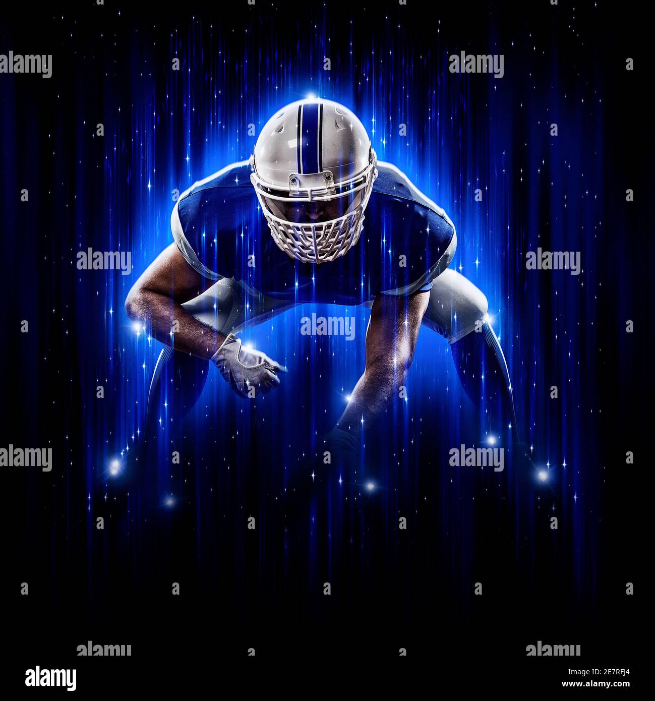 Football Player player with a superhero pose wearing a blue uniform on ...