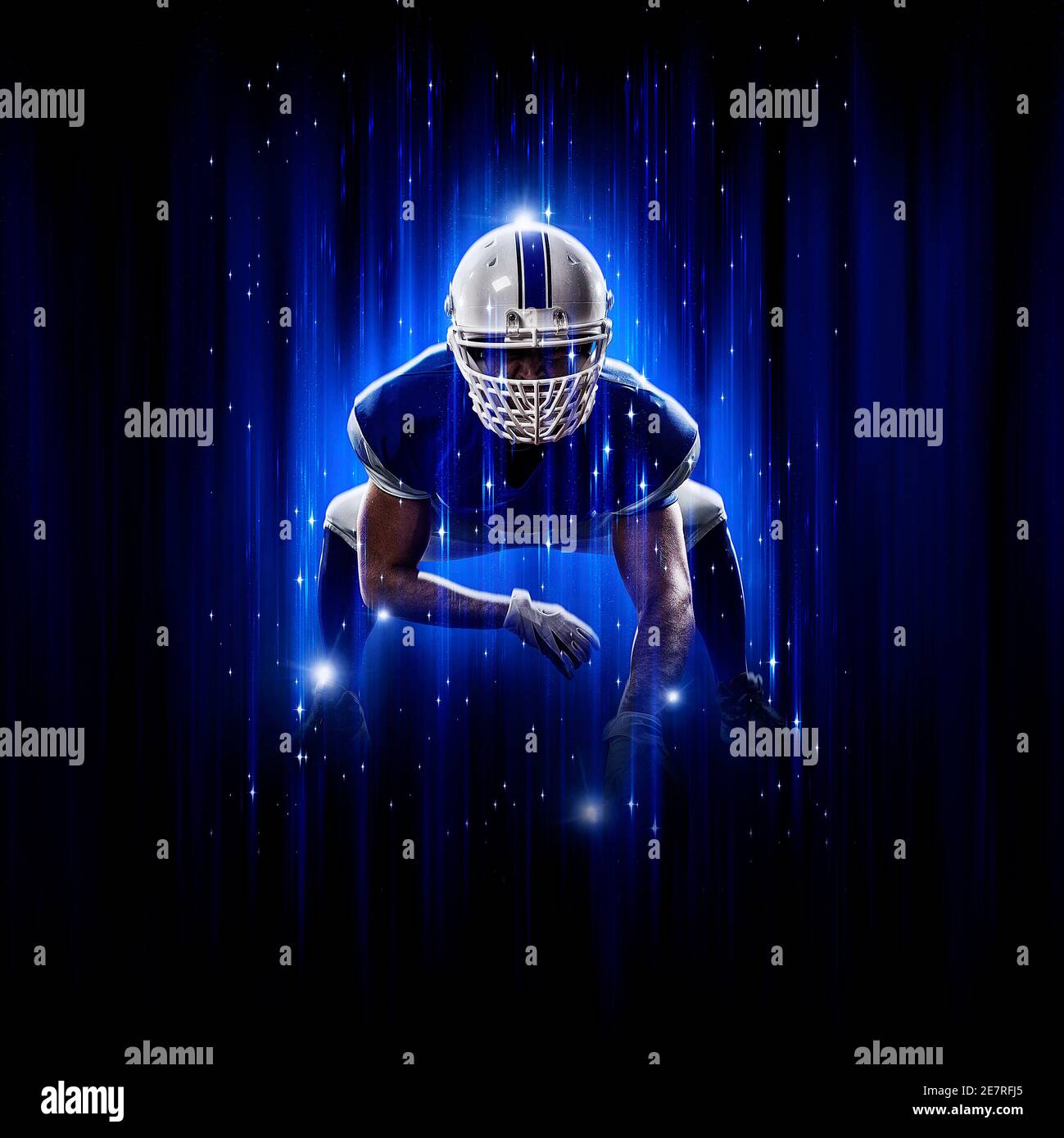 Football Player player with a superhero pose wearing a blue uniform on ...