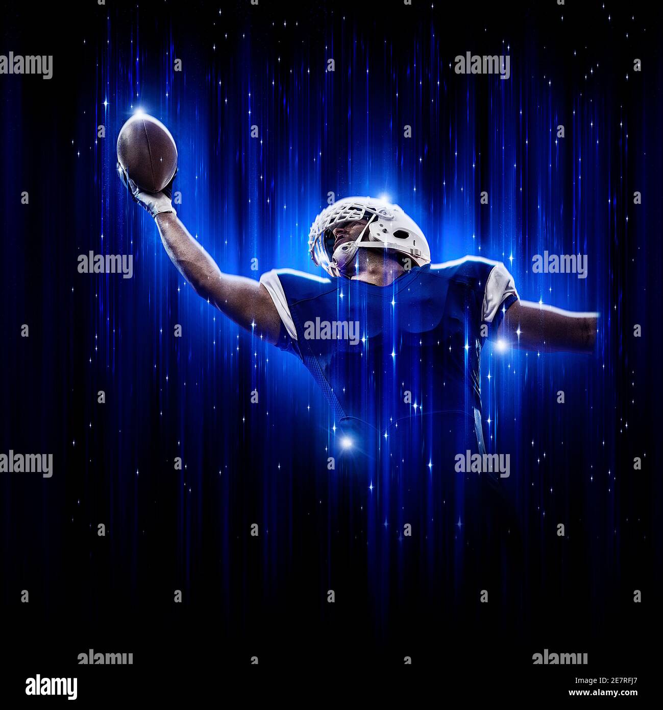 Football Player player with a superhero pose wearing a blue uniform on ...