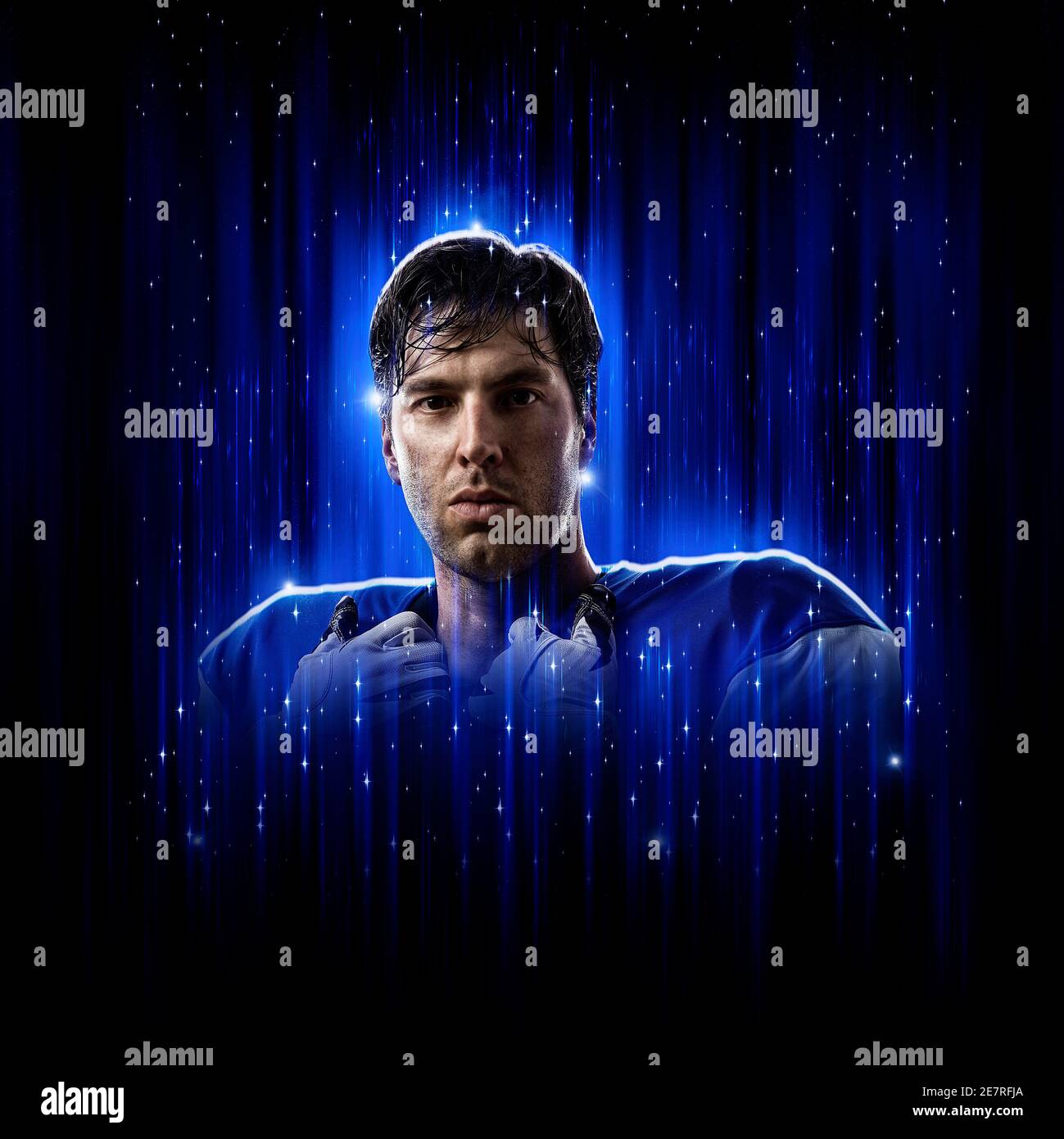 Football Player player with a superhero pose wearing a blue uniform on ...