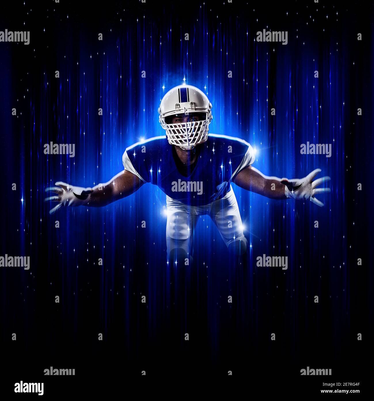 Football Player player with a superhero pose wearing a blue uniform on ...