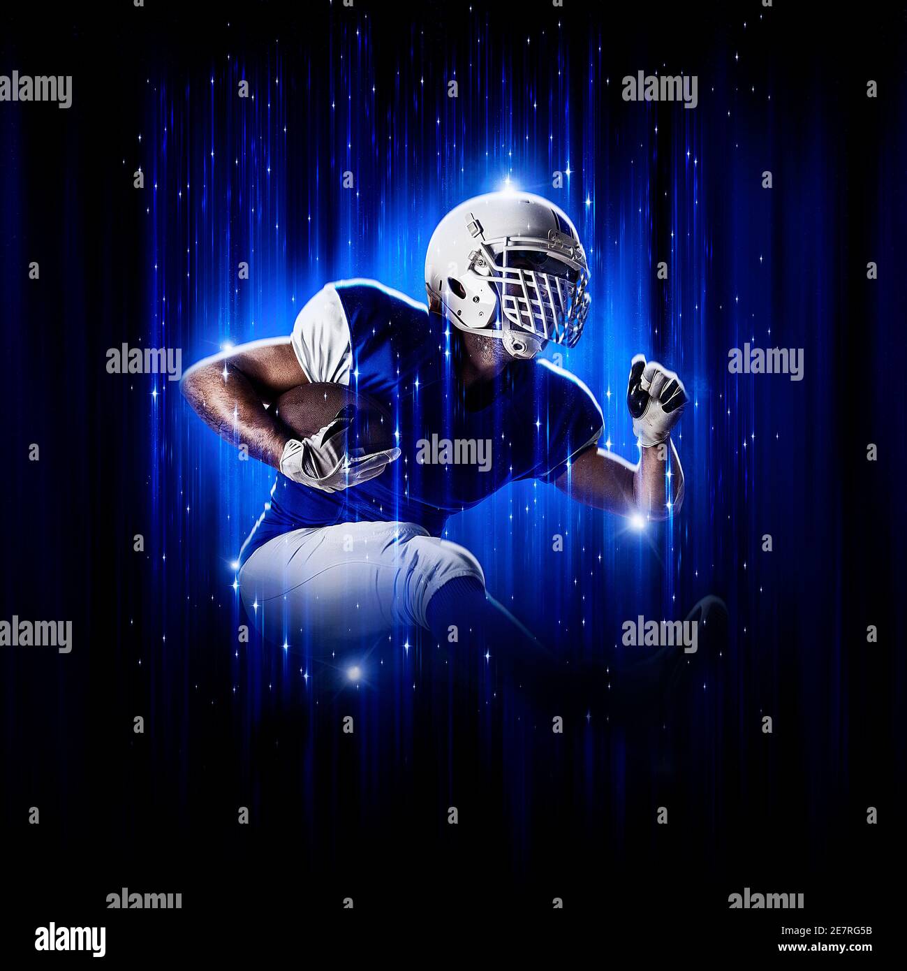 Football Player player with a superhero pose wearing a blue uniform on ...