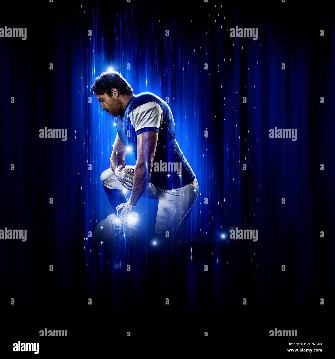 Football Player player with a superhero pose wearing a blue uniform on ...