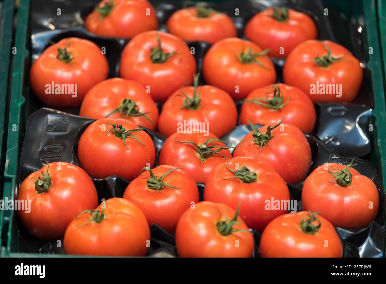Selection of red large tomatoes on sale in a supermarket Stock Photo ...