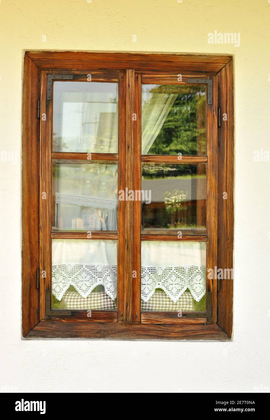Traditional vintage old brown wooden frame window. Front view, close up ...