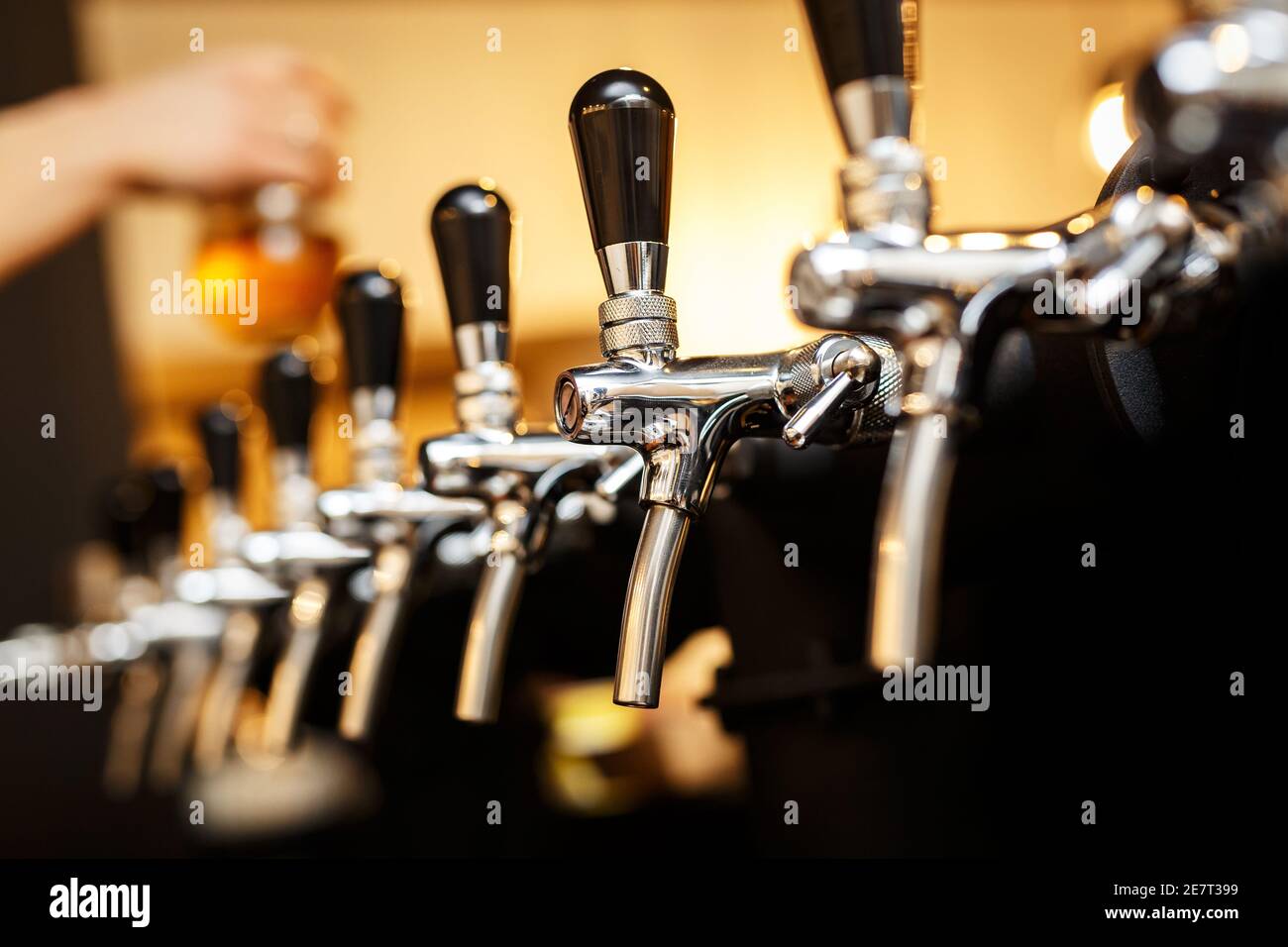 Row of taps in a beer tap Stock Photo - Alamy