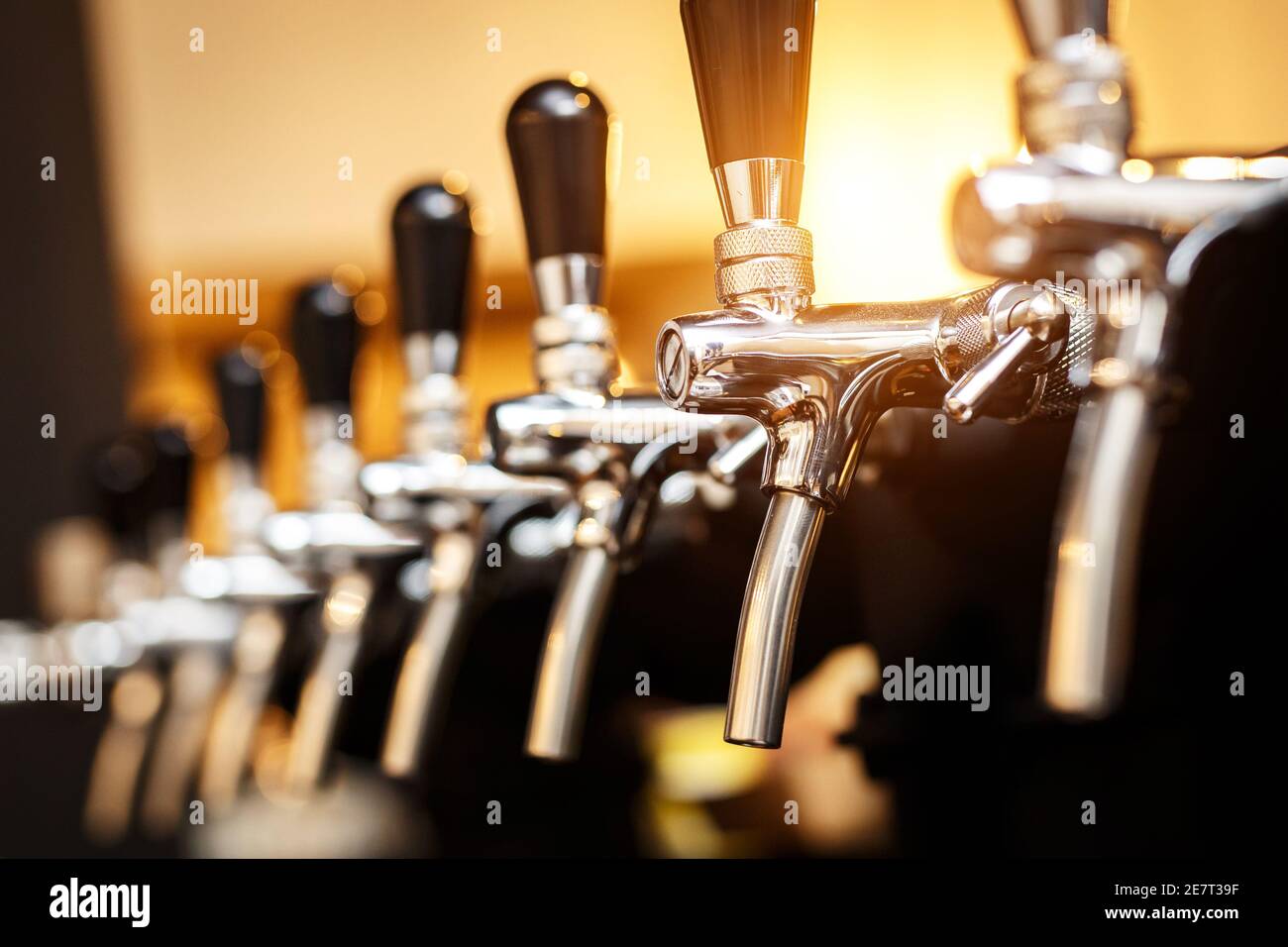 Row of taps in a beer tap Stock Photo - Alamy
