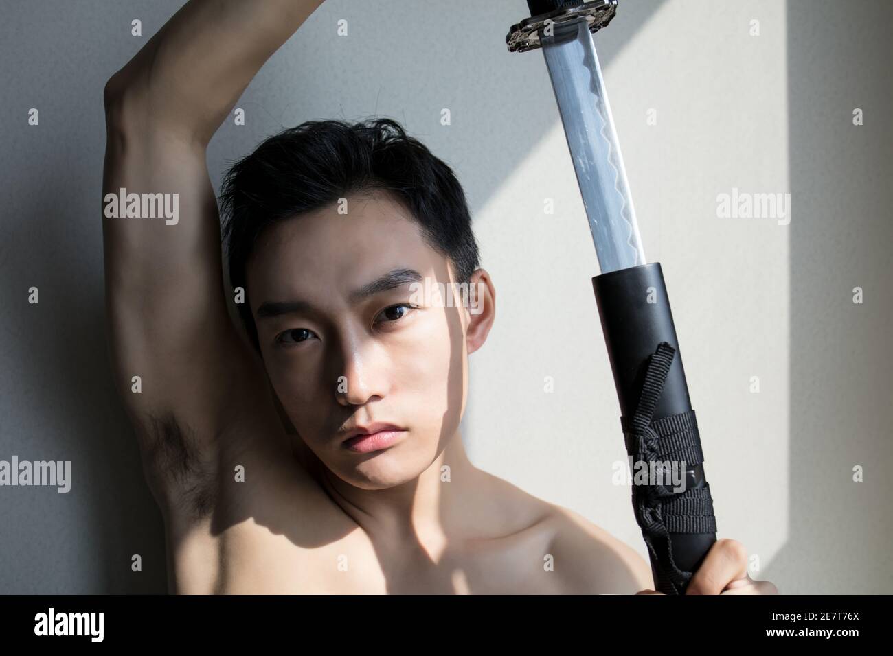 Young Man Holding Samurai Sword High Resolution Stock Photography and ...