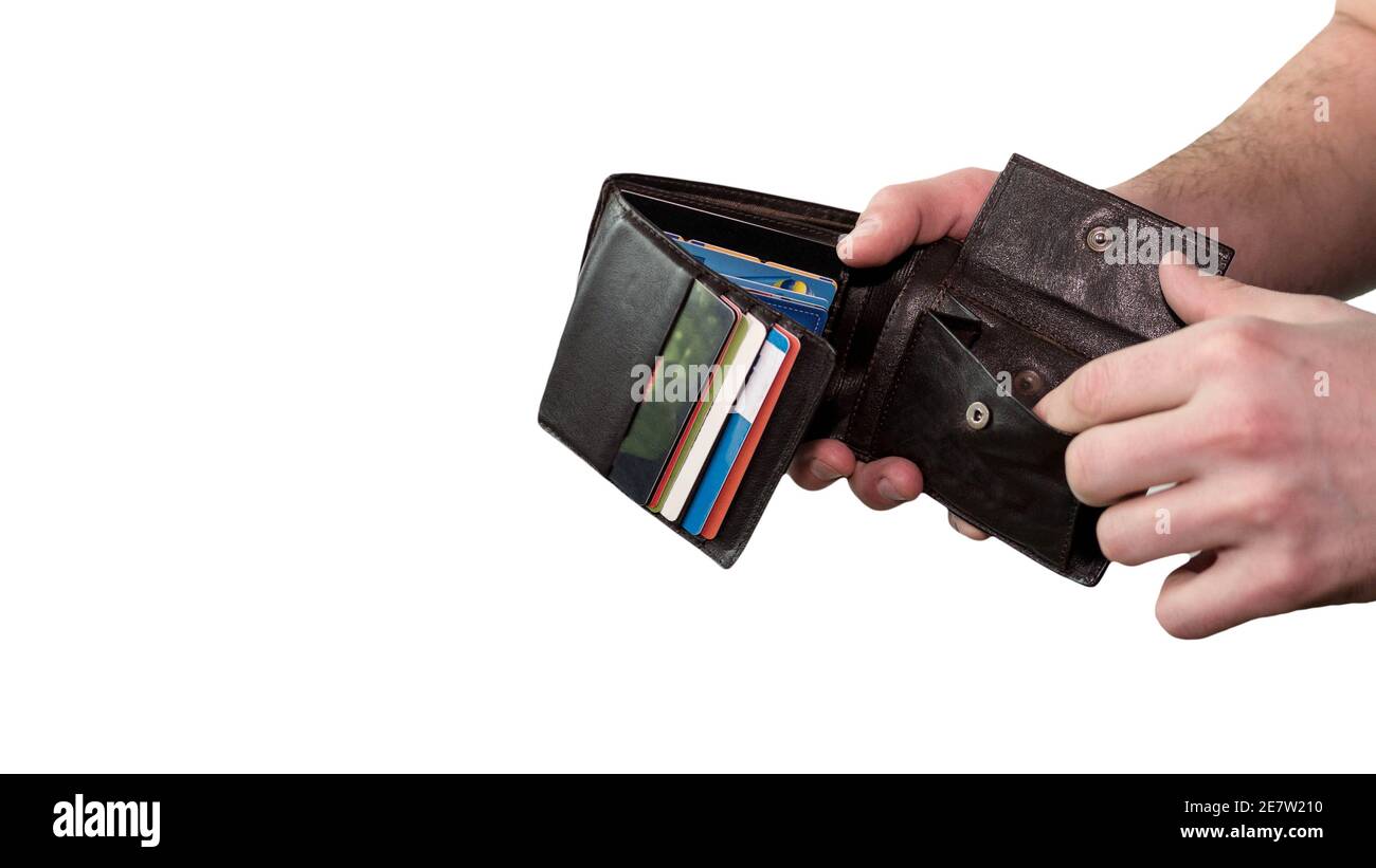 A man looks into an empty wallet without money, a wallet with credit ...