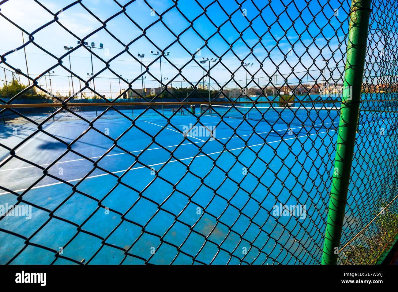 Empty tennis court. Fences of tennis court. Blue tennis court without ...