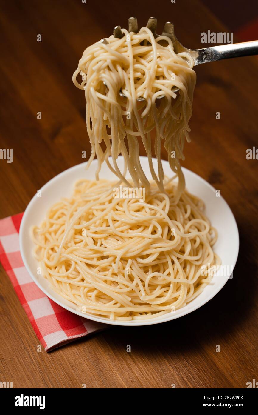 Vertical shot of a fork taking a portion of a tasty spaghetti Stock ...