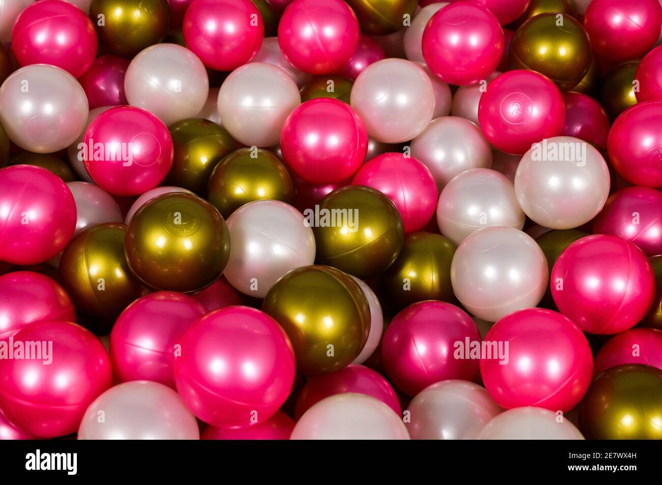 Top view of pink and gold dry pool balls one on another Stock Photo - Alamy
