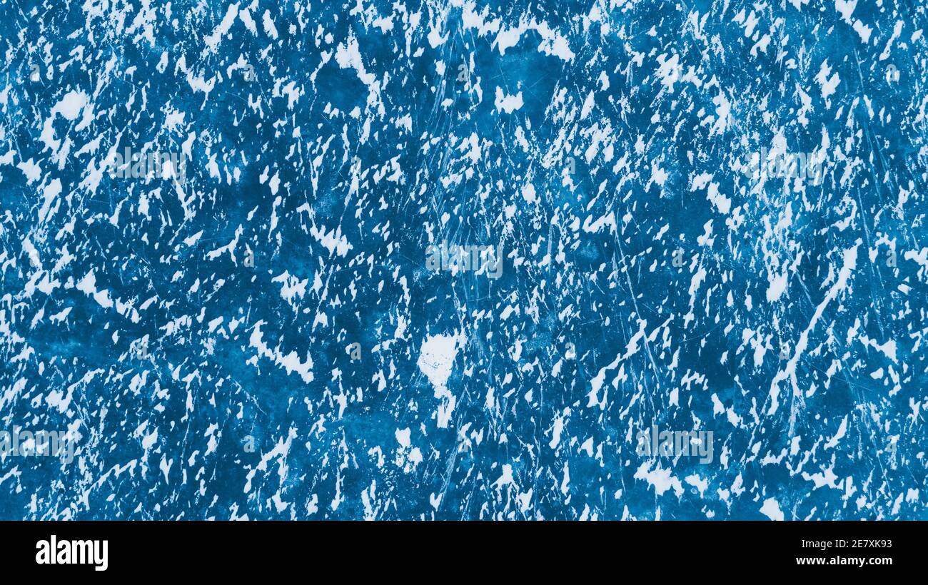 Blue ice surface with scratches and snow Stock Photo - Alamy