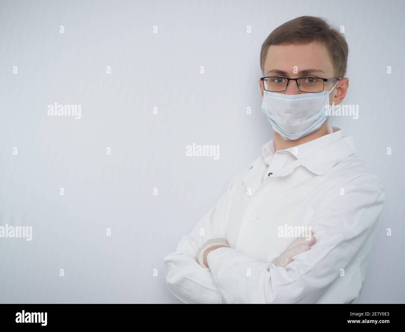 A young doctor of European appearance in medical clothes, a medical ...
