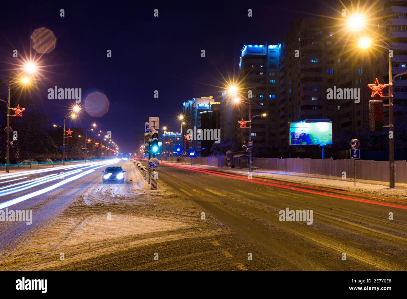 Winter night road in the city, snow background Stock Photo - Alamy