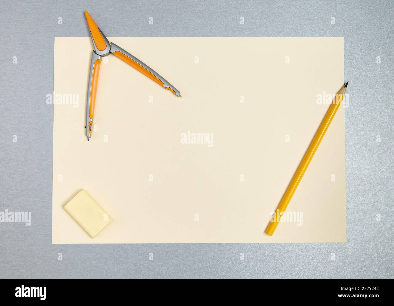 Top view of yellow tools for drawing. Pencil, compass, eraser and sheet ...