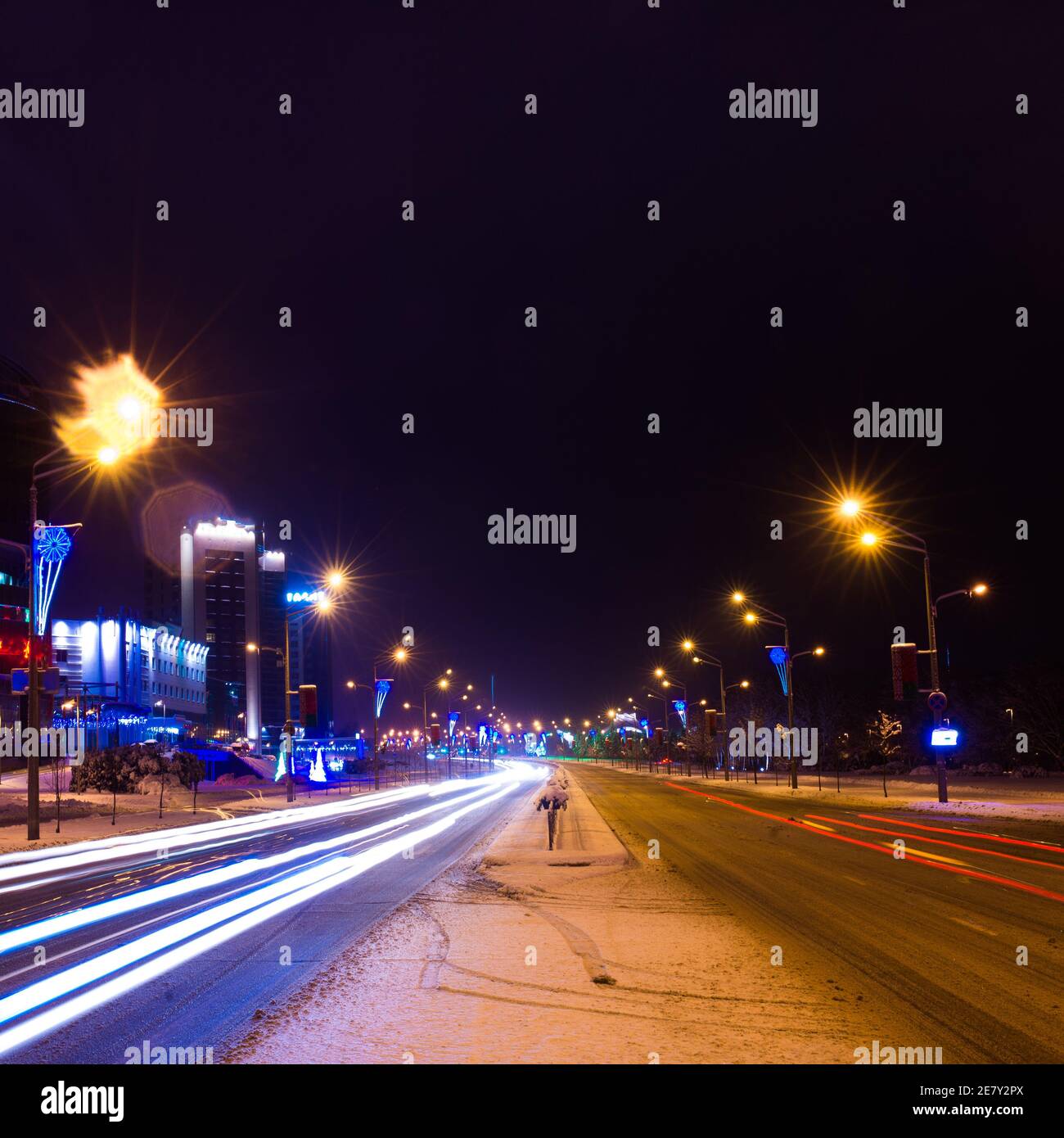 Winter night road in the city, snow background Stock Photo - Alamy