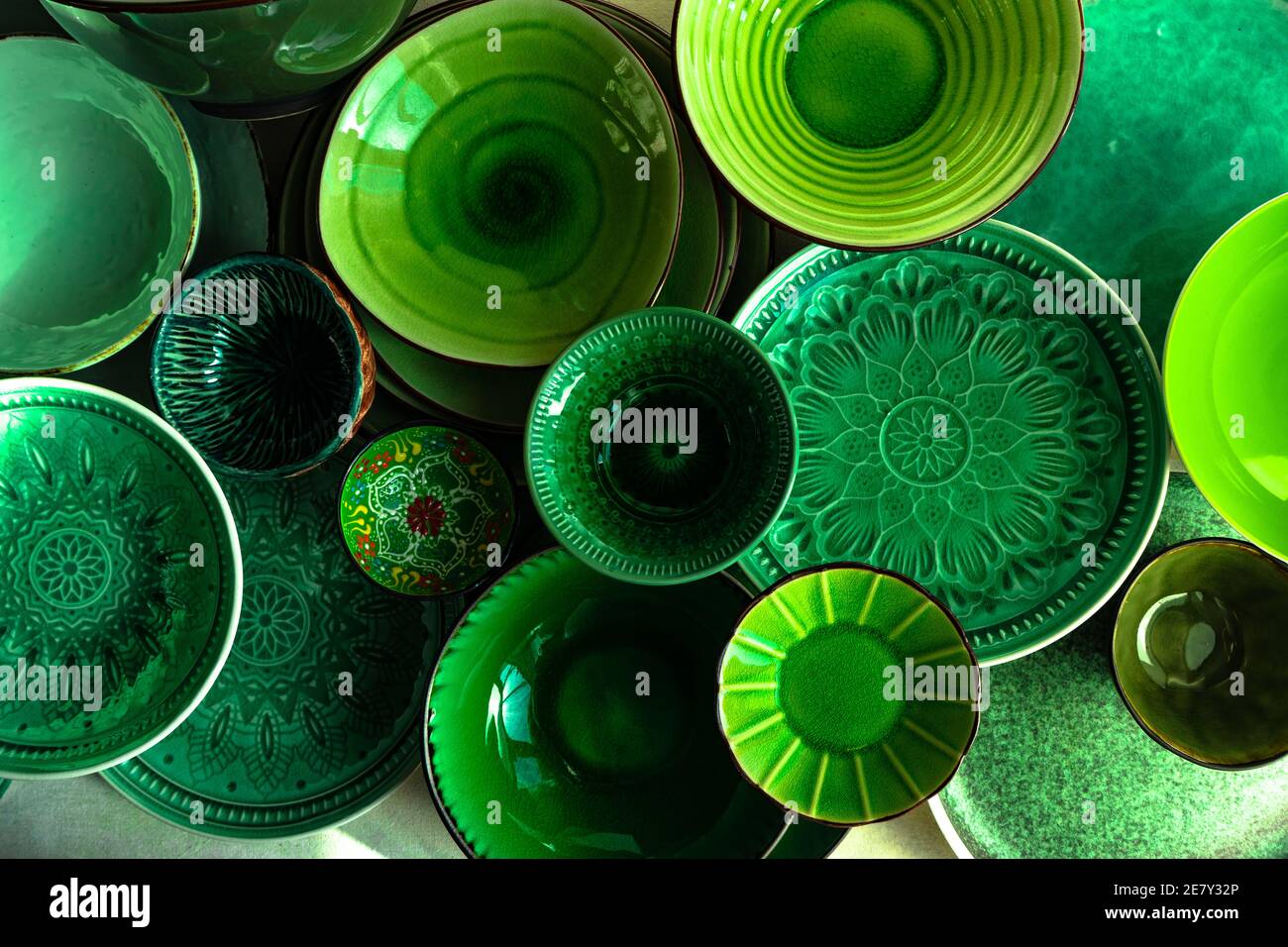 Green ceramic dinnerware as a food background Stock Photo - Alamy