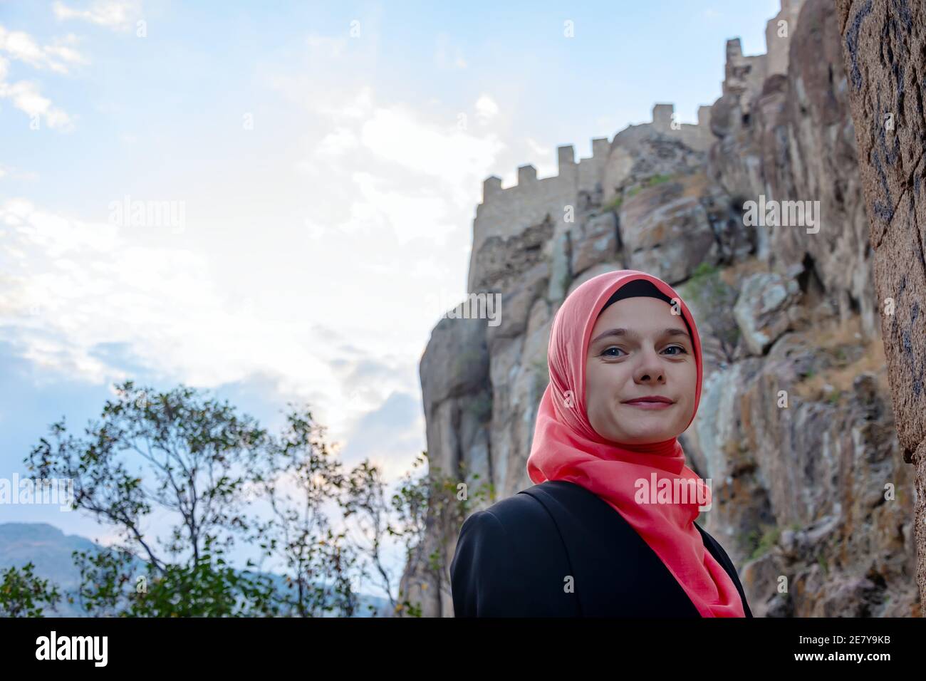 Muslim tourist visiting Afyonkarahisar castle in Afyon city. Small and ...
