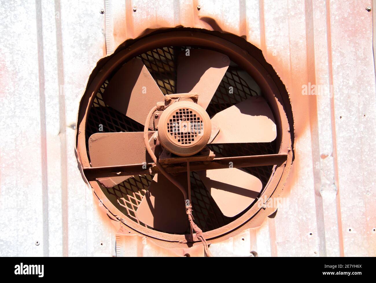 An industrial ventilation fan attached to a building Stock Photo - Alamy