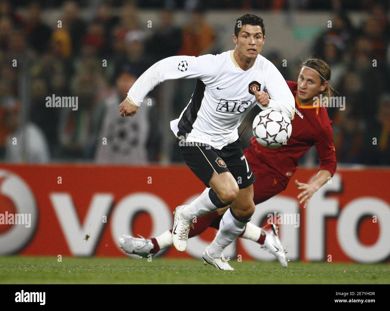 Manchester United's Cristiano and AS Roma's Philippe Mexes battle for ...
