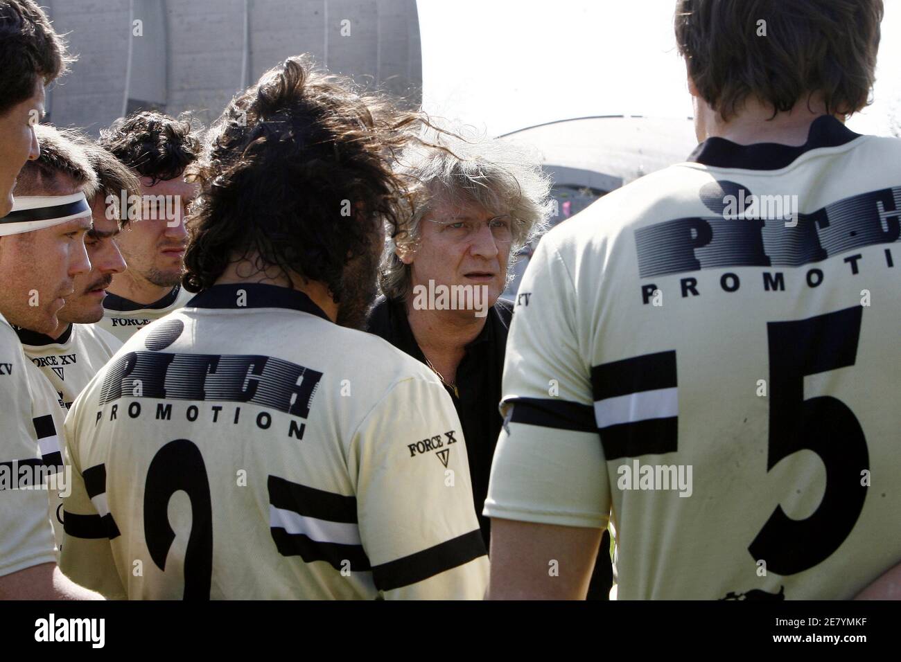 CA Brive president Patrick Sebastien speaks with his players during the ...