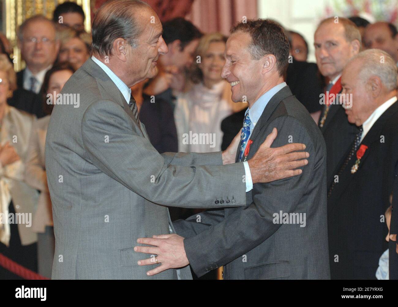 French president Jacques Chirac awards French soccer star Jean-Pierre ...