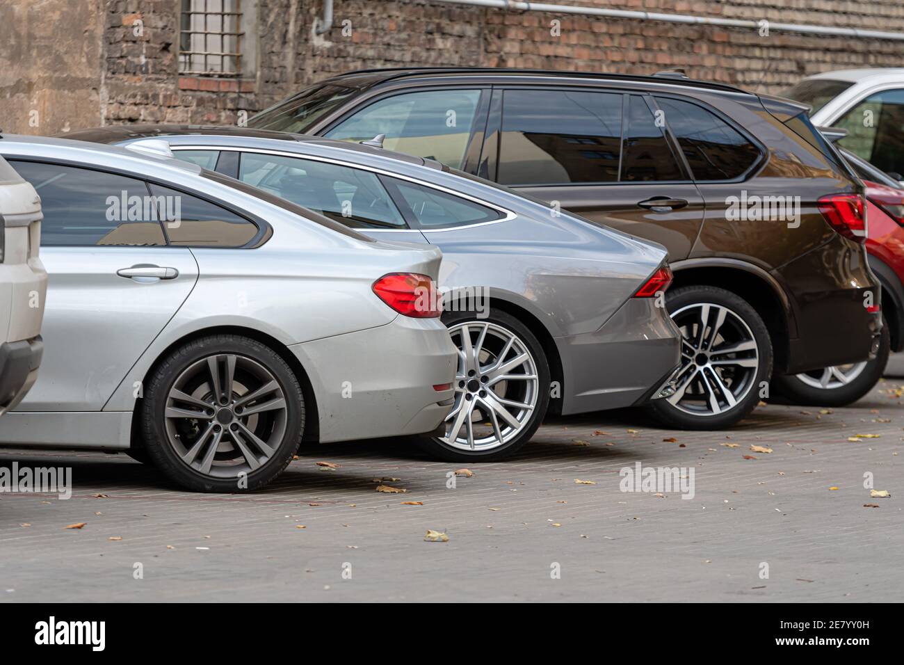 closeup of back side of parked cars in outdoor parking area Stock Photo ...
