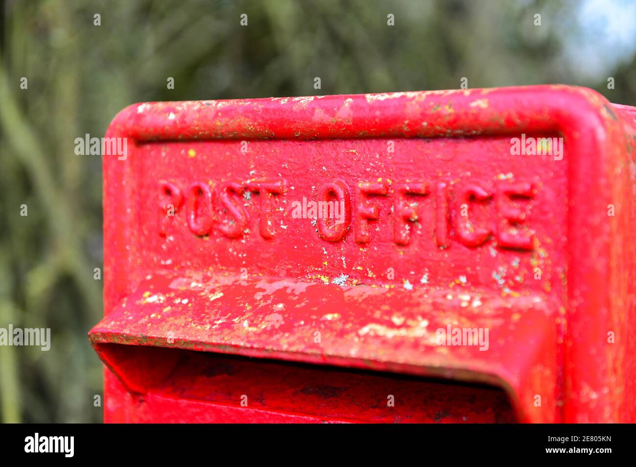 Red metal post box with the wording of Post Office Stock Photo - Alamy