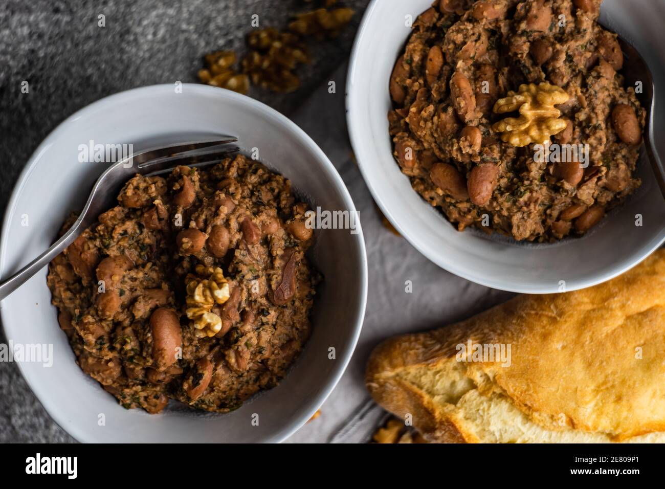 Traditional georgian bean dish - lobio with walnut, served in modern ...