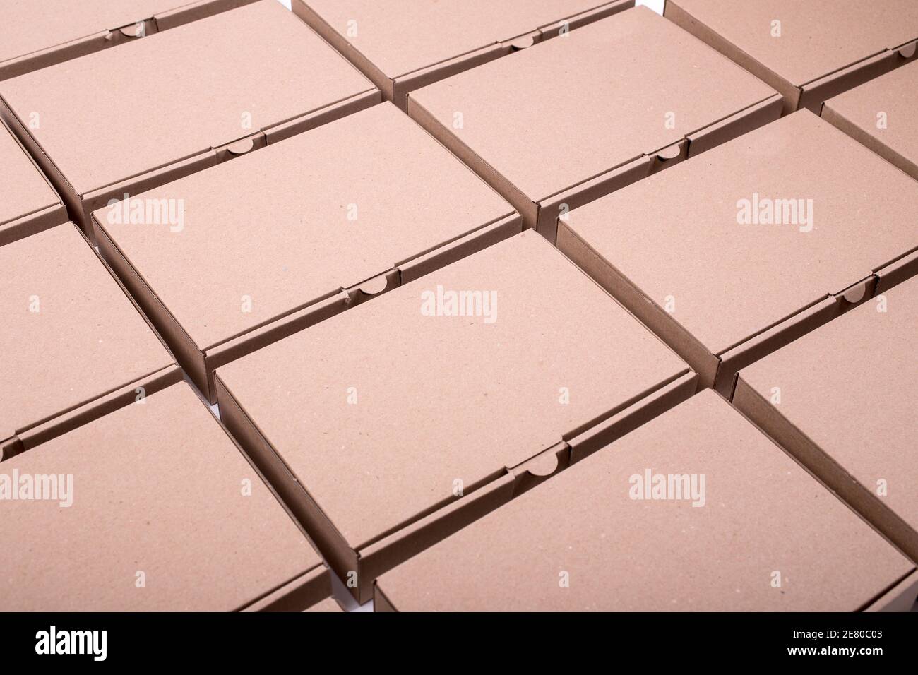 Set of Brown craft cardboard boxes in rows, background Stock Photo - Alamy