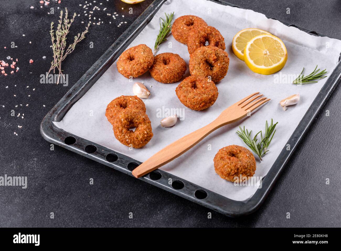 Beautiful delicious fresh chickpea falafel with sauces on a concrete ...