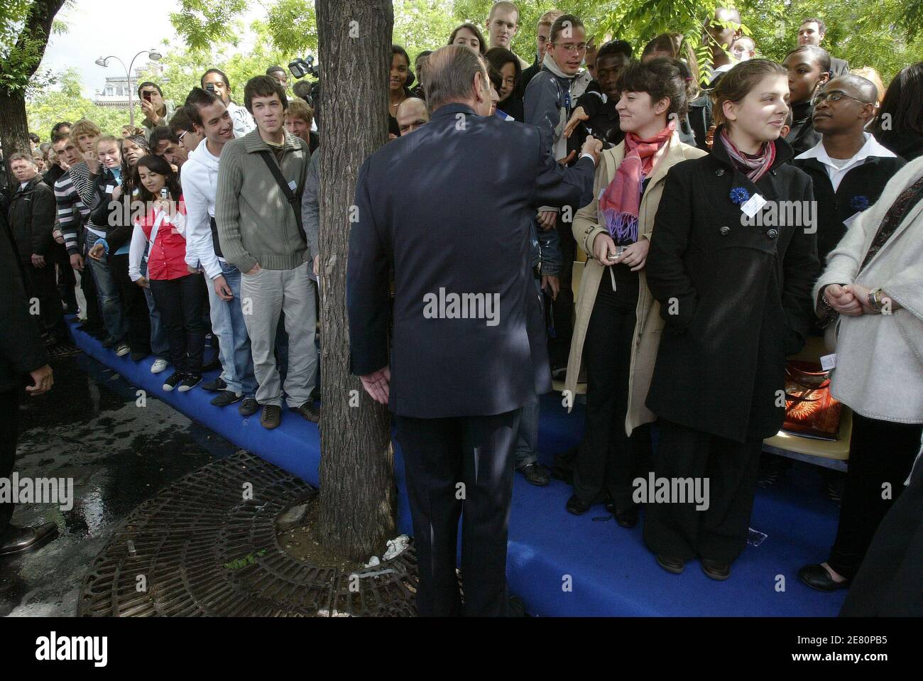 President Jacques Chirac shakes hands with supporters as he heads his ...