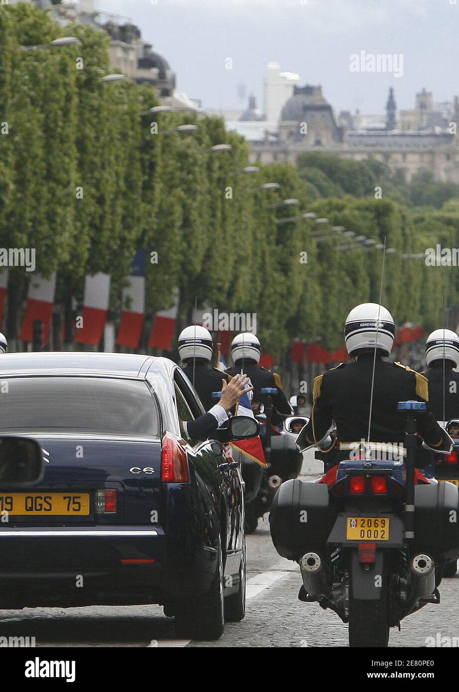 President Jacques Chirac waves the crowd as he leaves his last ceremony ...