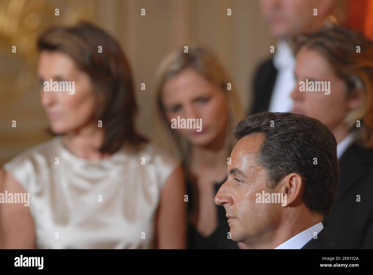 Cecilia Sarkozy stands with her children while her husband, President ...