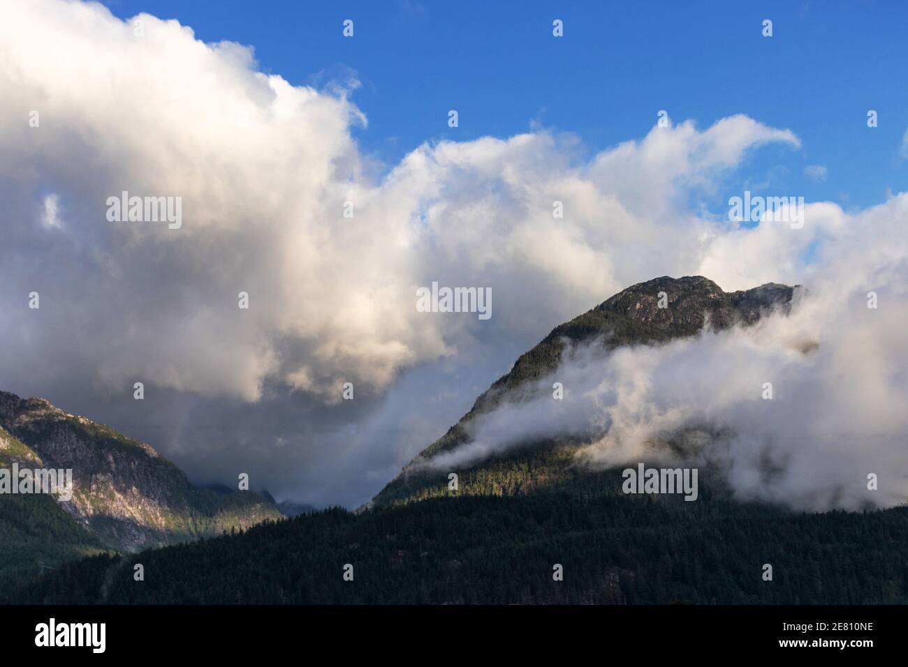 Bright afternoon sky and the Squamish mountains, Squamish, BC, Canada ...