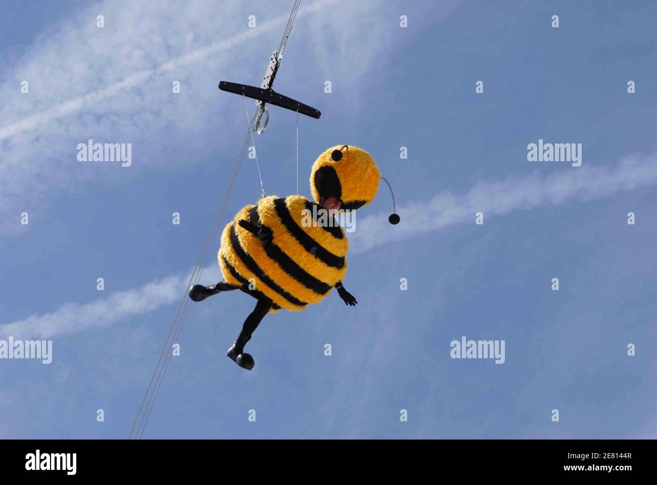 US actor Jerry Seinfeld, dressed as a giant bug, flies from the rook of ...